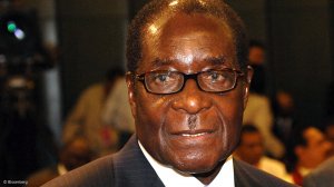 I'm on my way out, Mugabe tells children